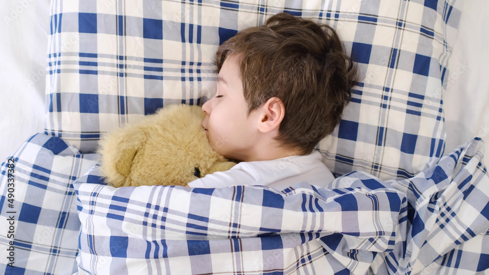 little kid boy sleeping in bed with toy. Cute healthy little toddler ...