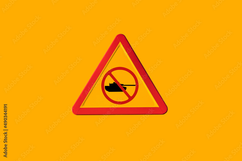 Danger traffic sign with a military tank with the forbidden symbol on a ...