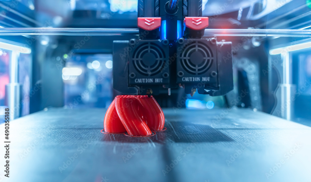 3D printer or additive manufacturing and robotic automation technology ...