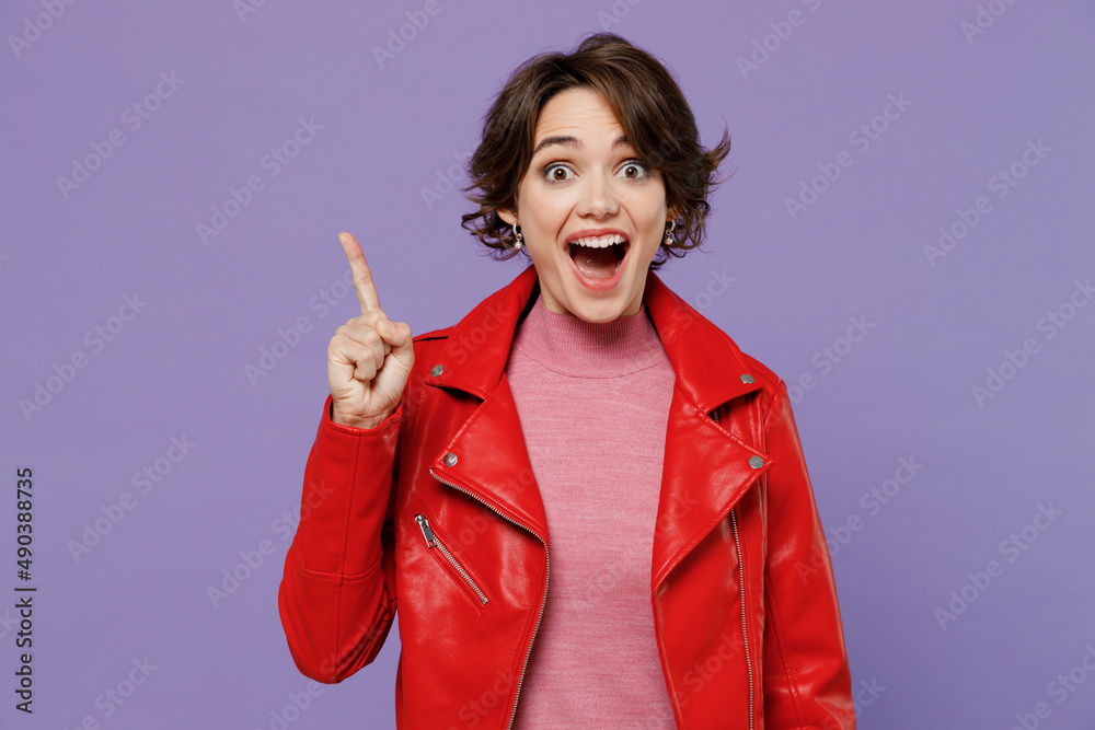 Young insighted proactive woman 20s in red leather jacket holding index ...