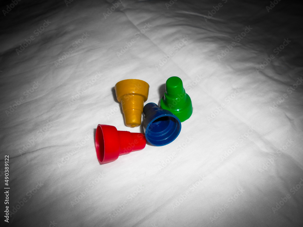 Board Game, Ludo Tokens in red blue green yellow colors Stock Photo ...