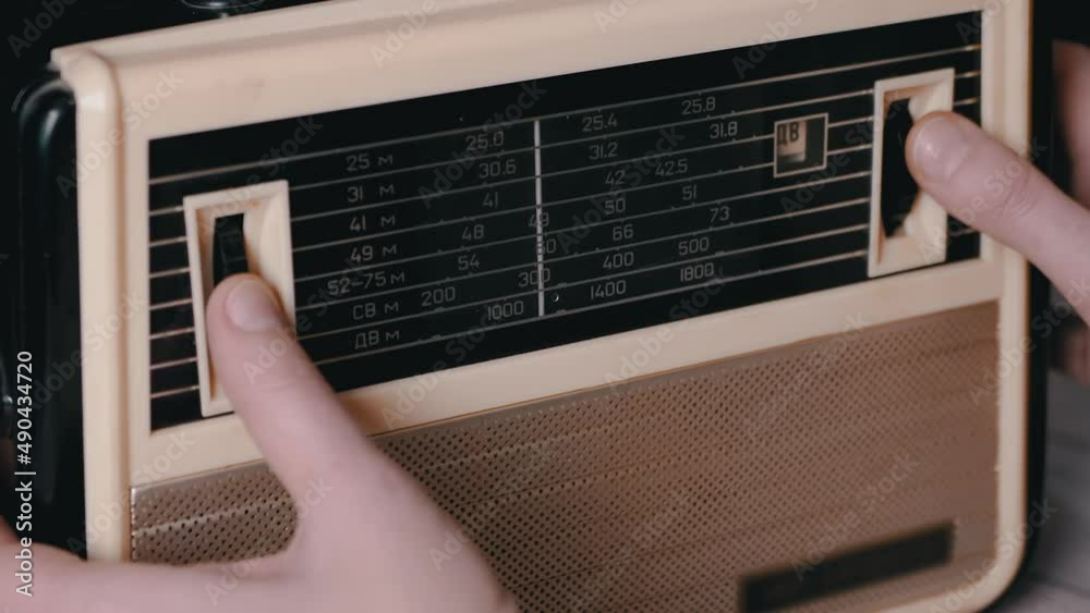 A Female Fingers Tuning the Frequency on an Old Vintage Analog Receiver ...