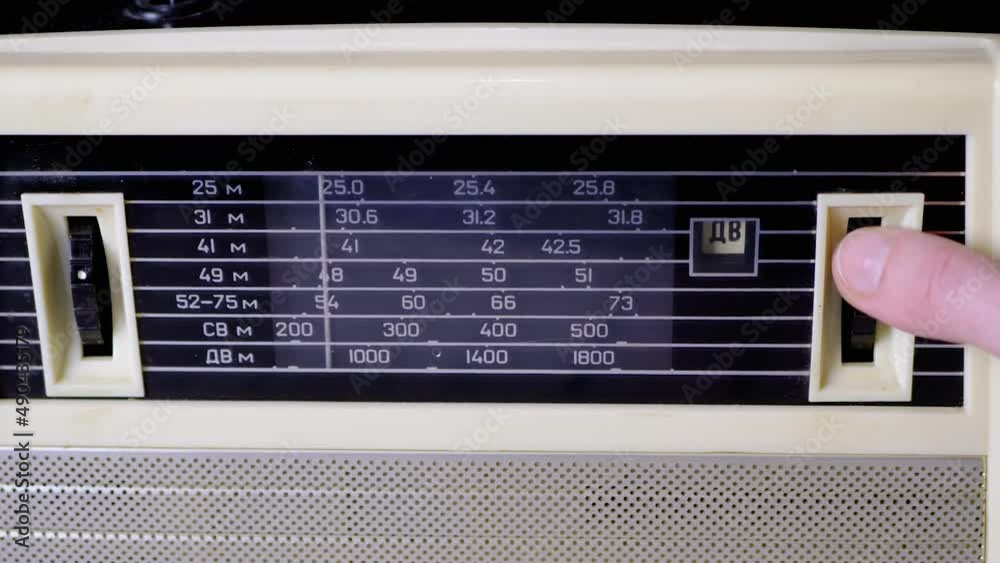 A Female Fingers Tuning the Frequency on an Old Vintage Analog Receiver ...