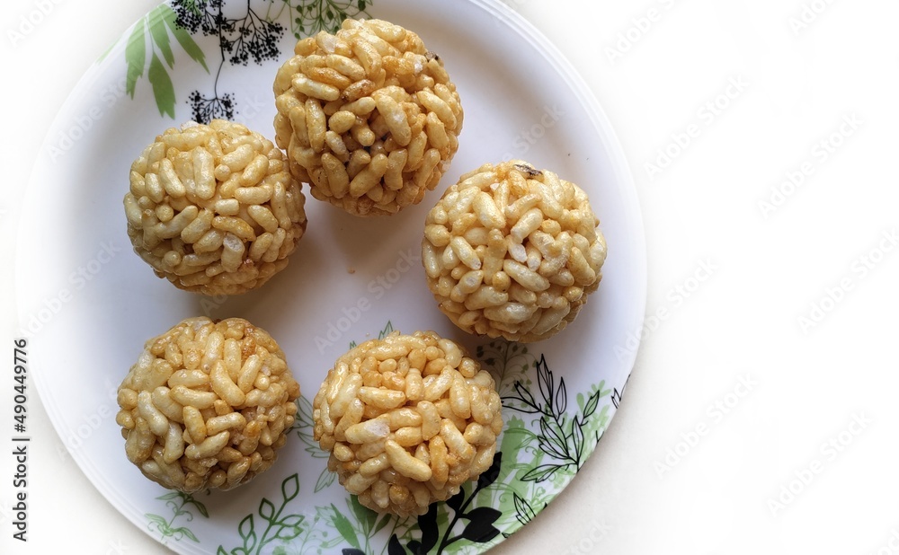 Indian Traditional Puffed Rice Balls is a sweet made using puffed rice ...