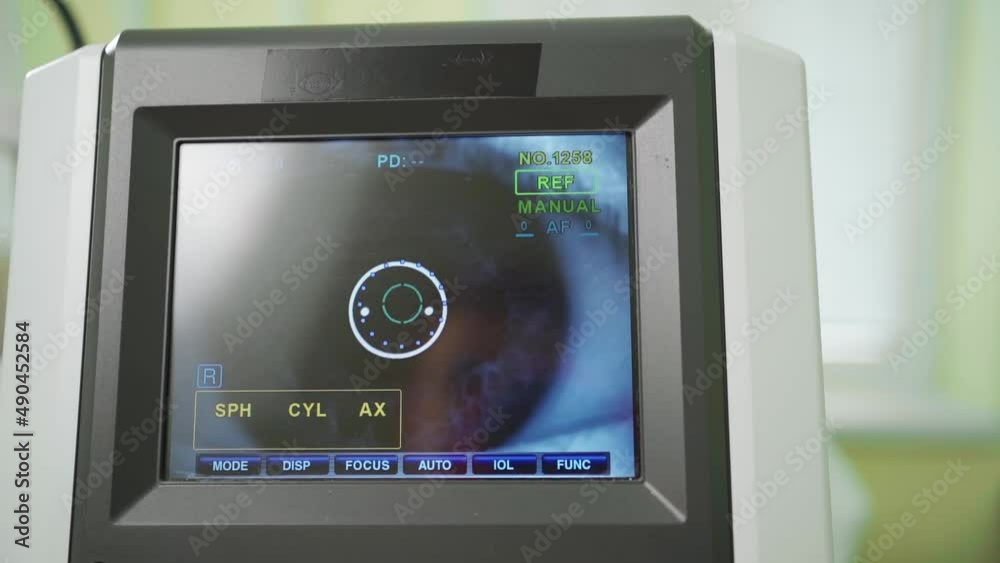 eye on the screen of the autorefractometer. a modern ophthalmic device ...