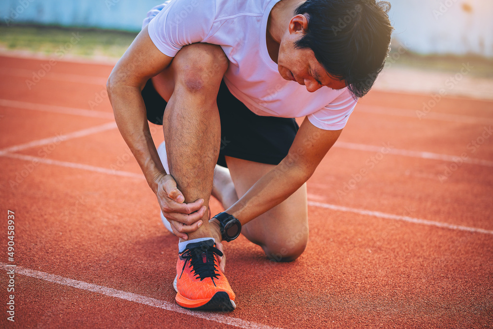 Man runner has twisted ankle injury for practice marathon run at the ...