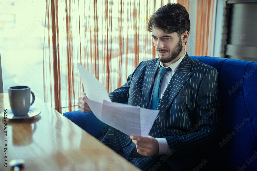 businessman checking papers Stock-Foto | Adobe Stock