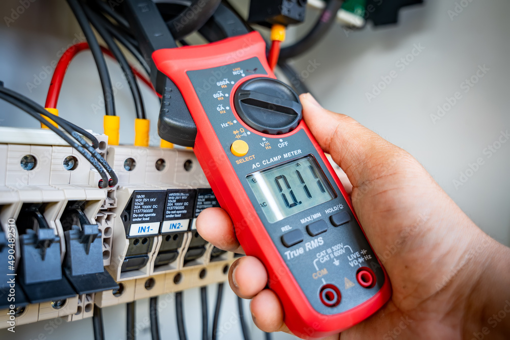 The solar farm(solar panel) with engineers use multimeter check the ...