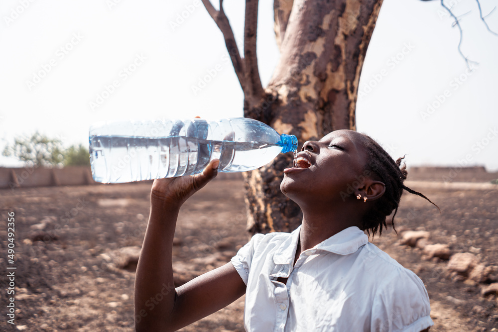 African Woman Drinking Water
