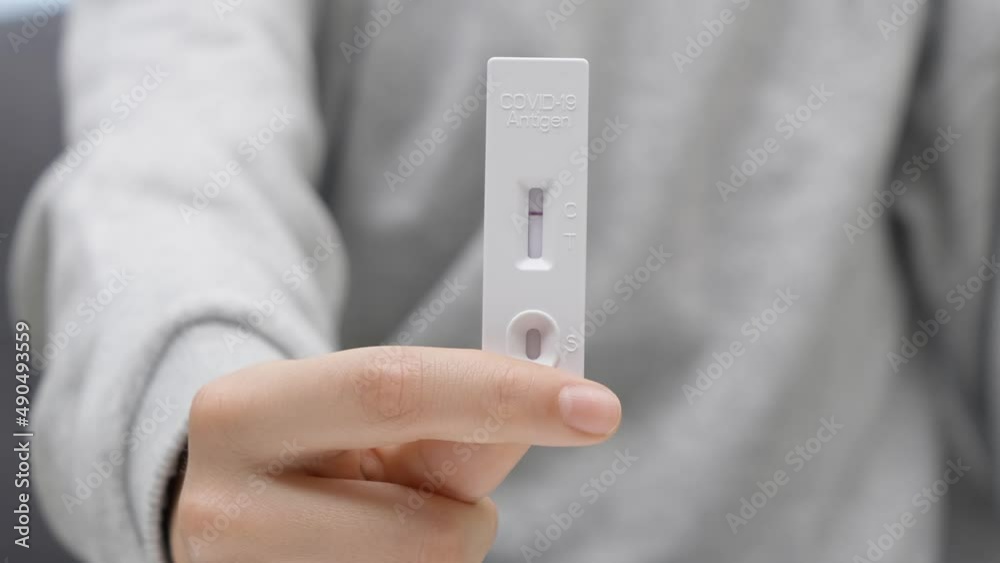 Coronavirus pandemic protection. Teenager using rapid antigen test kit ...
