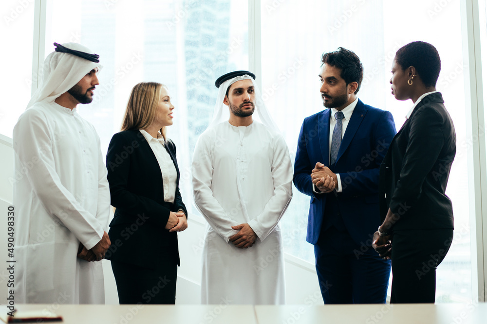 Multiethnic western and middle eastern business team working together ...