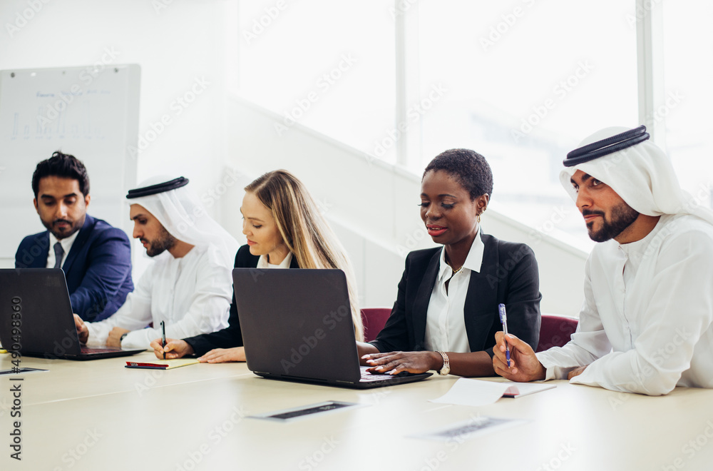 Multiethnic western and middle eastern business team working together ...