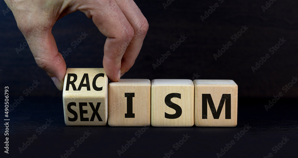 Stop Racism And Sexism Symbol Businessman Turns A Wooden Cube And