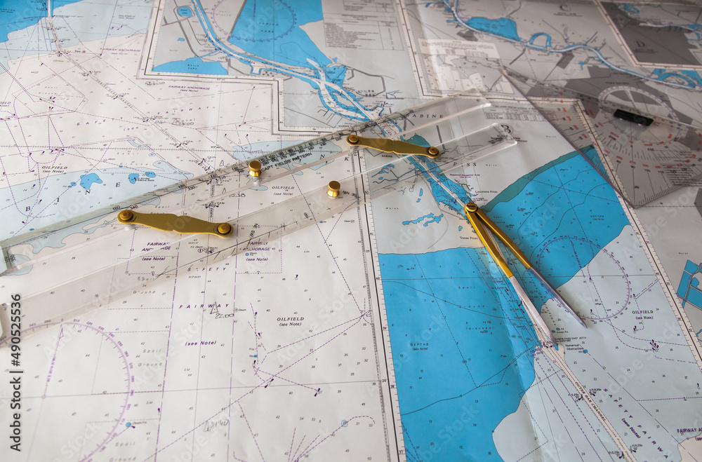 Maps of the ship for plotting. Plotter, divider and ruler. Close-up ...