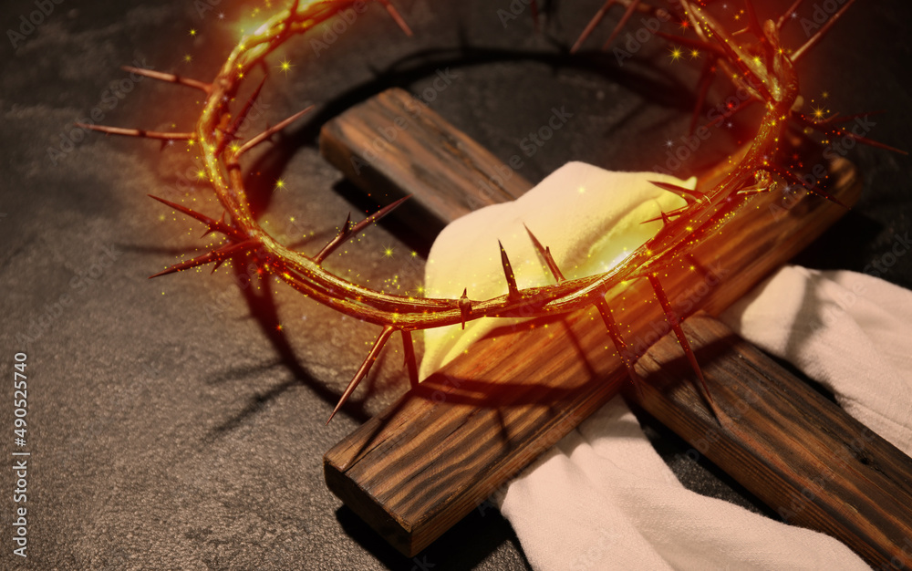 Glowing crown of thorns with wooden cross and shroud on dark background ...