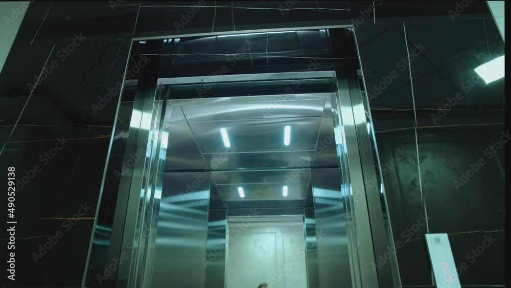 Cabin of modern passenger elevator. Digital lift scoreboard showing floor number. Digital ...