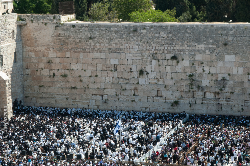 Jewish worshippers crowd into the prayer section below the Western Wall ...