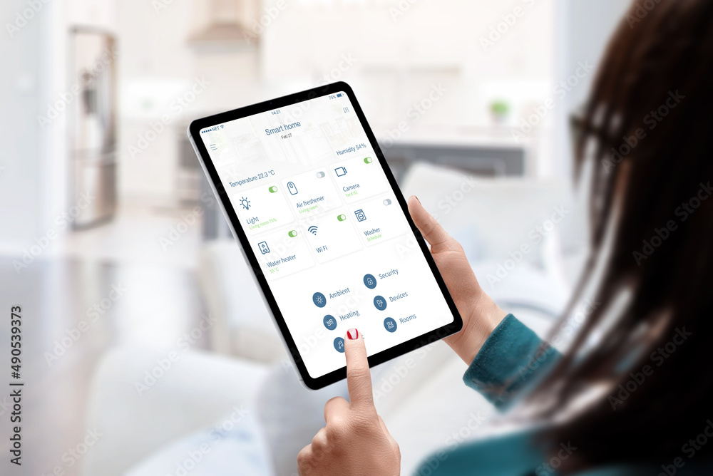 Woman use smart home automatization app for monitoring and control home ...