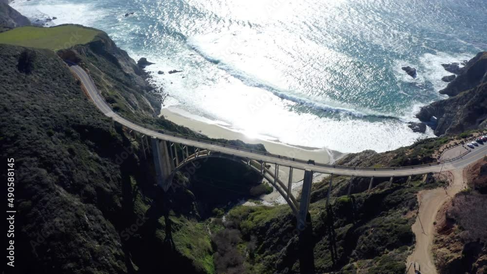 Aerial view cars passing Bixby Creek Bridge PCH Highway 1 in California ...