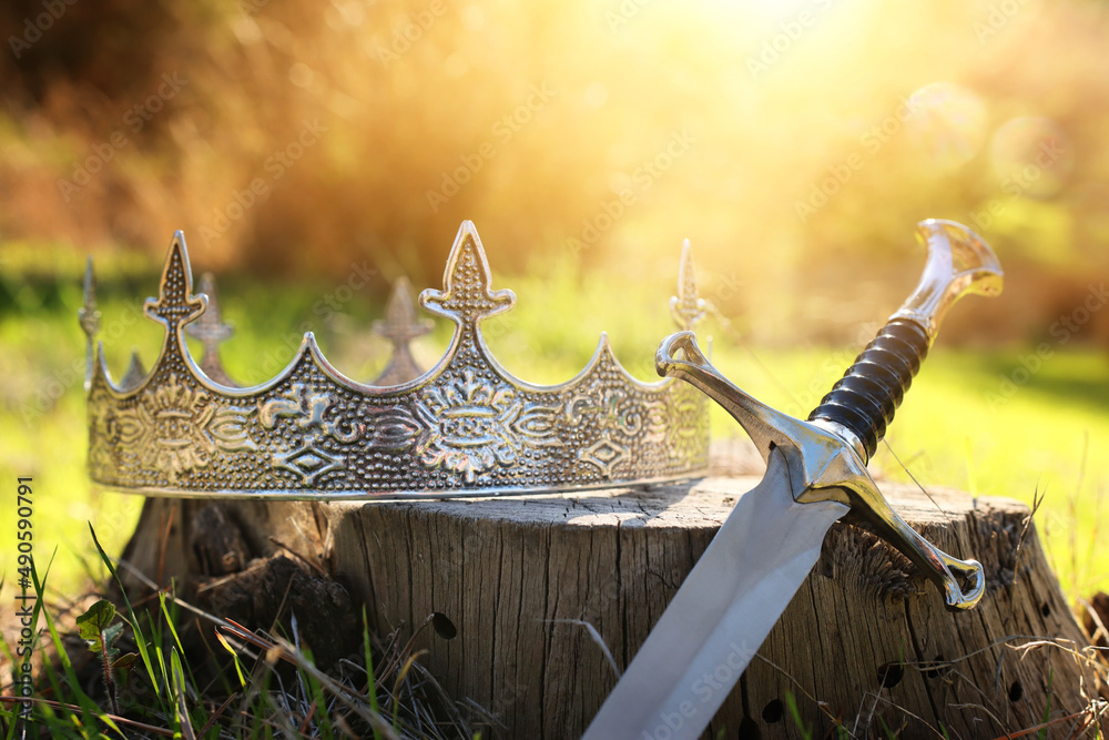 mysterious and magical photo of silver king crown and sword in the ...