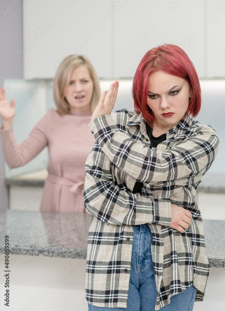 Family conflict. Angry mother screams at afraid teen daughter, girl ...