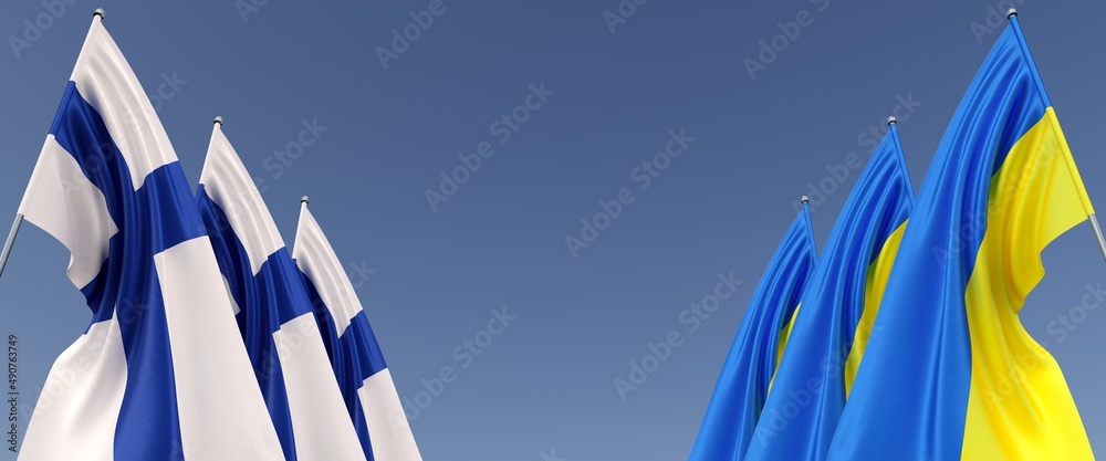 Flags of Ukraine and Finland on flagpoles on sides. Flags on blue ...