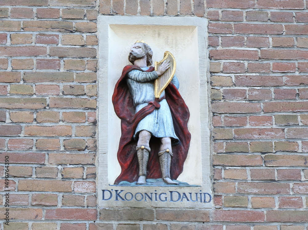Historic Sculpted Stone Tablet Depicting King David on a Brick Wall in ...