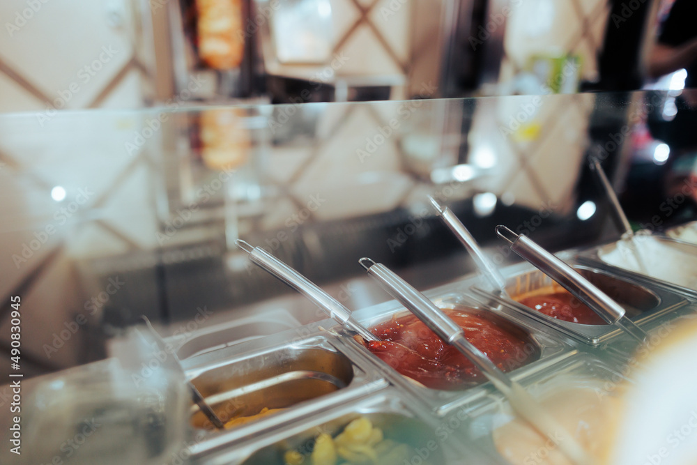 Tomatoes Spicy Sauces in a Showcase Window of a Fast-Food Restaurant ...