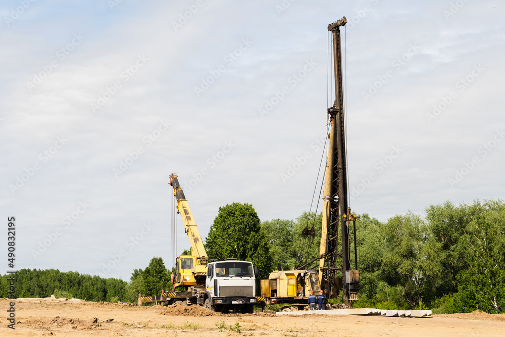 The beginning of building a house. The technique installs the piles in ...