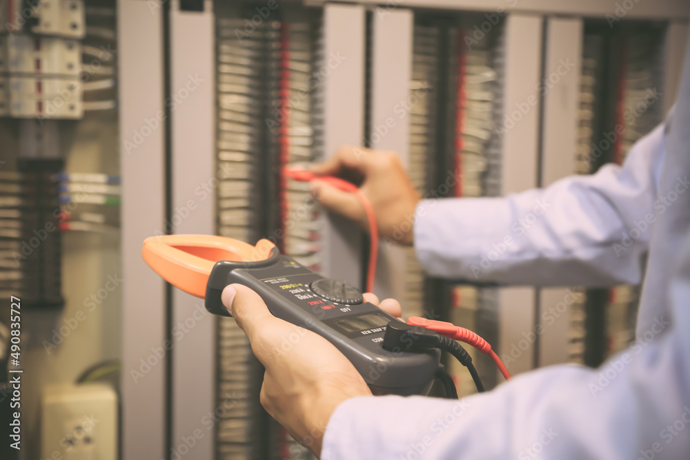 Electricity and electrical maintenance service, Engineer hand holding ...