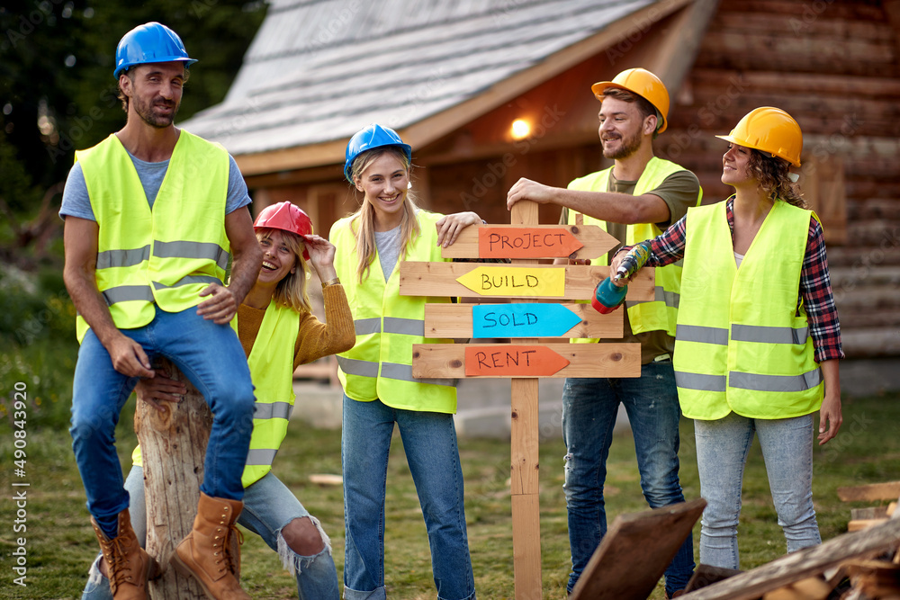 Group of construction workers powerful team. Playful team. Young ...