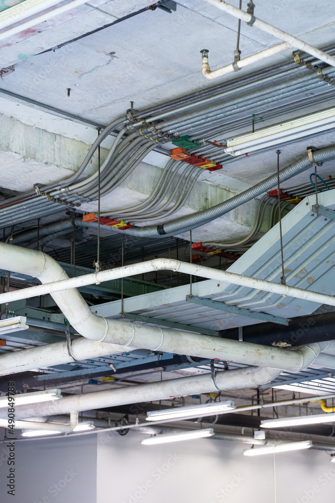 Electrical conduits system and metal pipeline installed on building ...