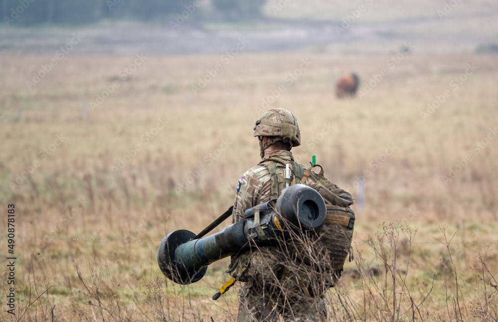 British army soldier completing an 8 mile combat fitness test tabbing ...