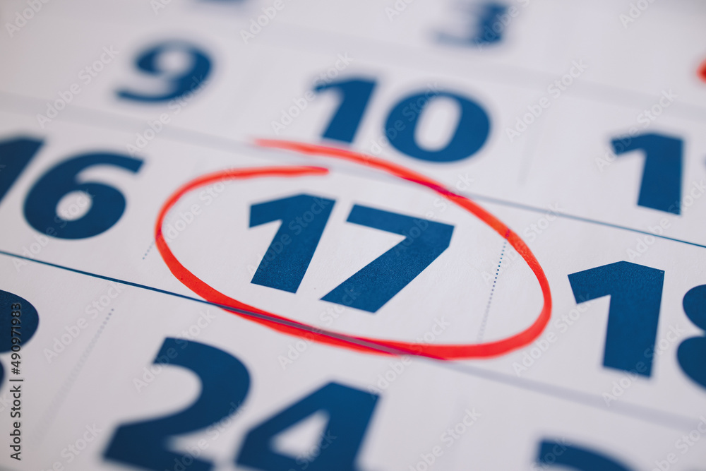 Marking the seventeenth 17 day of a month in the calendar with a red ...