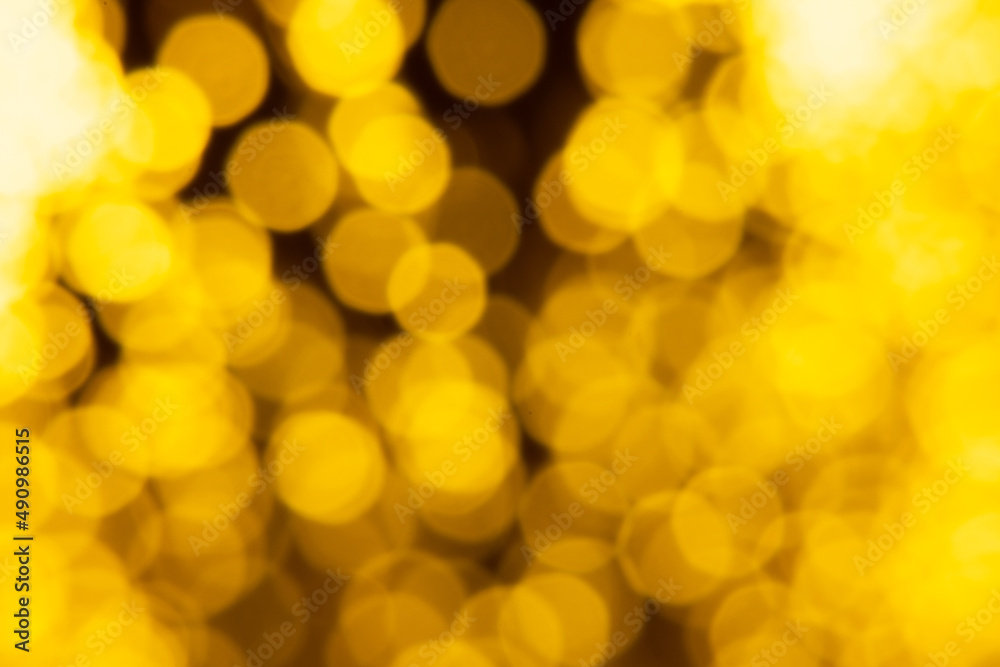 Colorful yellow lights and bokeh. Neon lights on a dark background ...