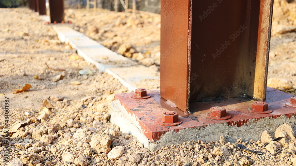 Nuts and nut on the cement base. Weld the posts to the base plate and ...