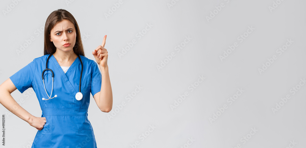 Medical workers, healthcare, covid-19 and vaccination concept. Frowning ...