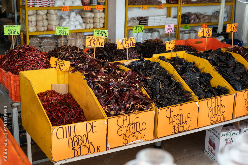 Display of a variety Mexican dried chillies on display in a shop, chile ...
