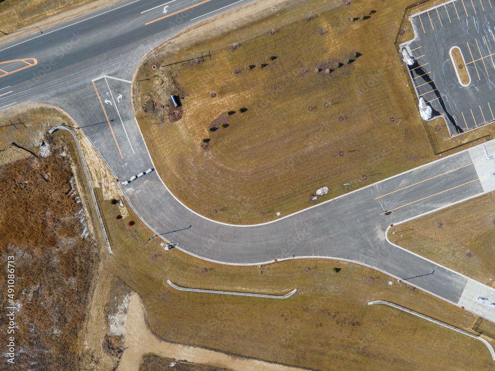 Birds eye view of road intersection with various markings. Fencing ...