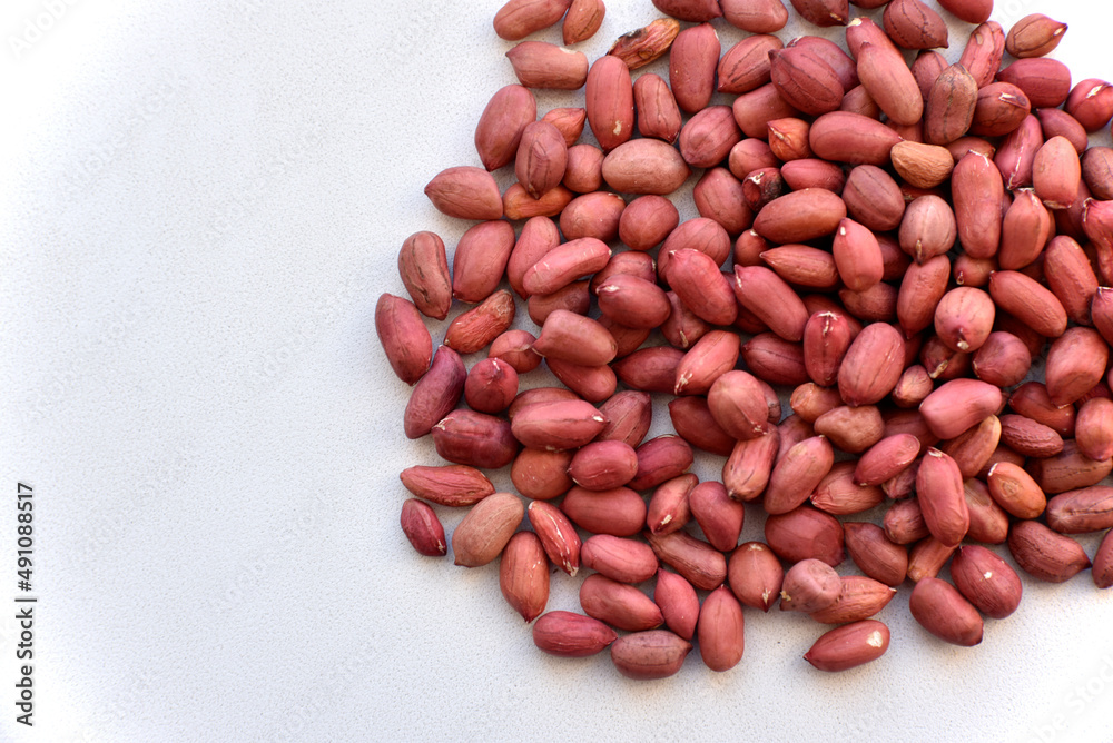 Red peanuts on a white background Stock Photo | Adobe Stock