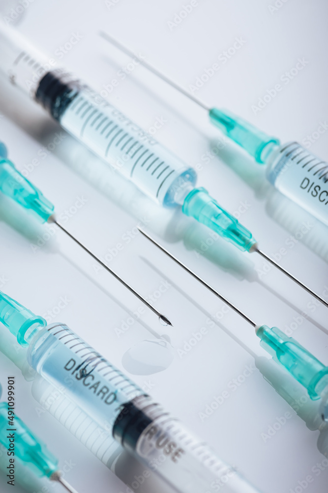 Medicine. A bunch of different syringes over a white background Stock ...