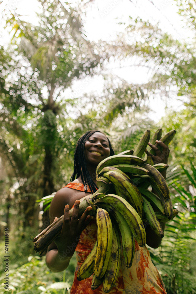 Happy portrait of a proud black african nature activist holding her ...