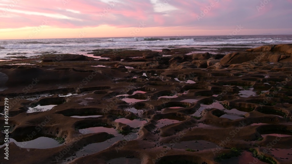 Eroded rock formation, tide pool shape in La Jolla, California coast ...