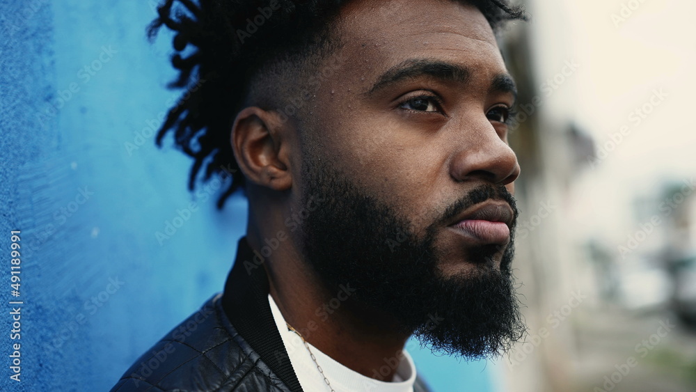 A pensive black man face closeup thinking Stock Photo | Adobe Stock