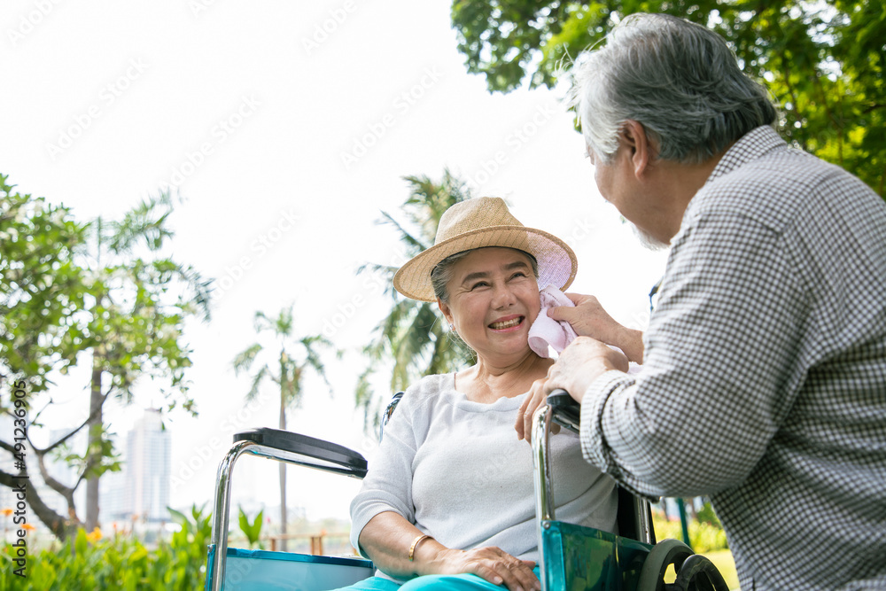 An elderly male patient sat on a wheelchair because he was sick with ...