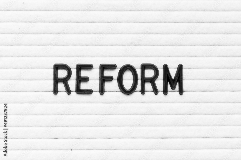 Black color letter in word reform on white felt board background Stock ...