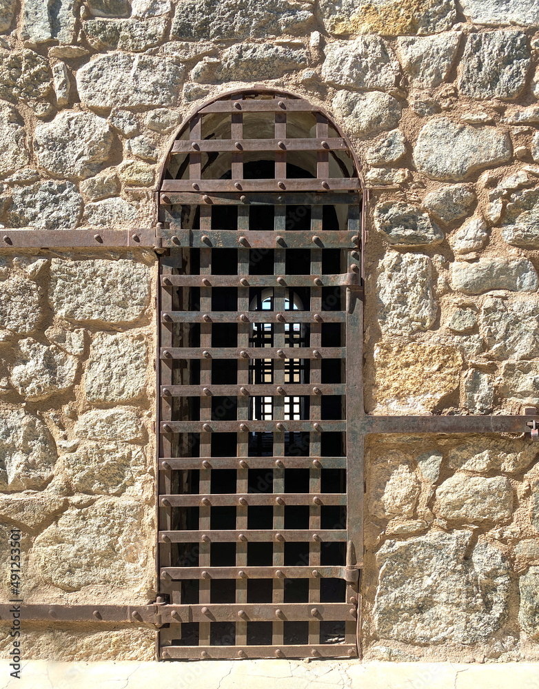Old prison cells with weathered metal bars and stone walls Stock Photo ...
