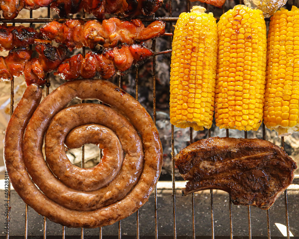South African braai including boerewors sausage, mielies, lamb chops ...