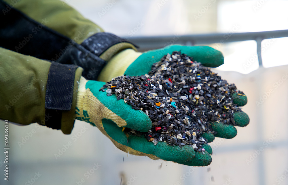 Close up of granulated plastic waste on a recycling plant for plastics ...