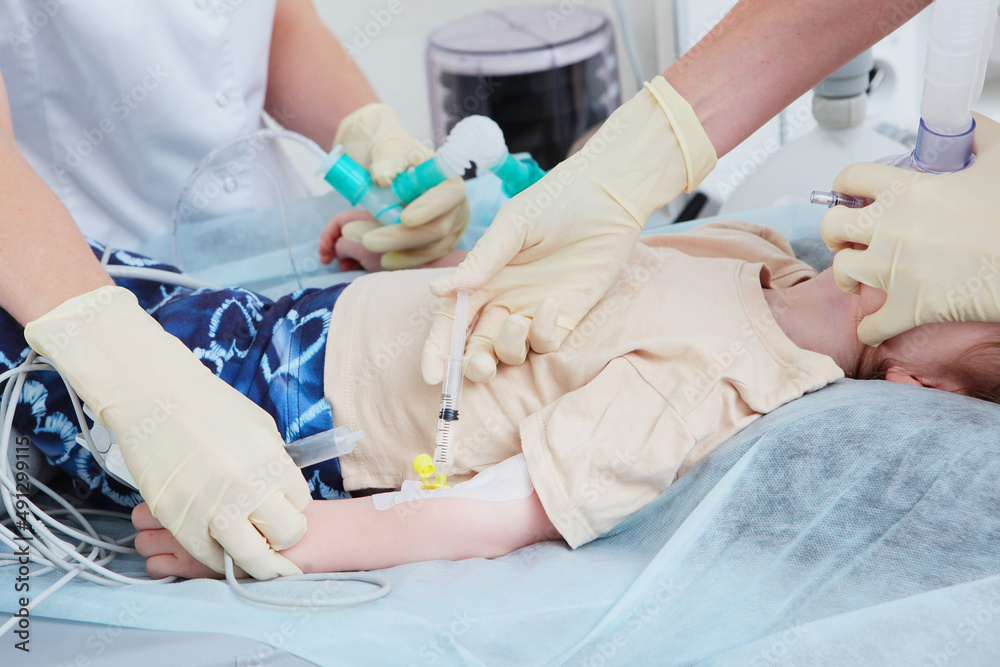 Introduction to anesthesia before surgery. The anesthesiologist makes ...